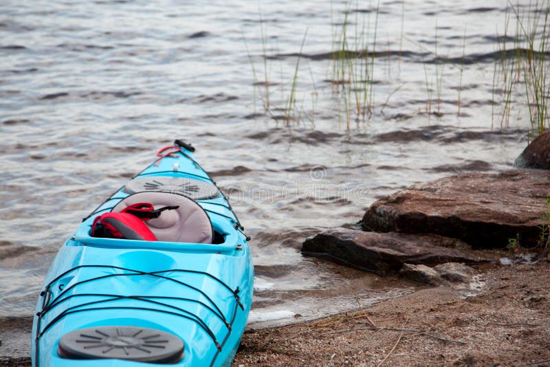 Blue kayak in the lake stock image. Image of peaceful - 97912335