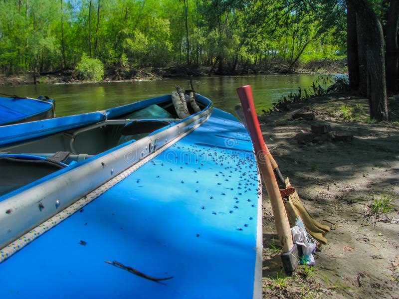 Blue Kayak on the Shore. Tools Near the Kayak Stock Image - Image of ...