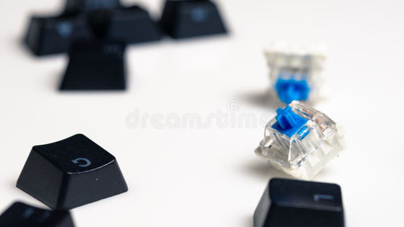 Blue Keyswitch with Scattered Keycaps for Keyboard on White Background ...