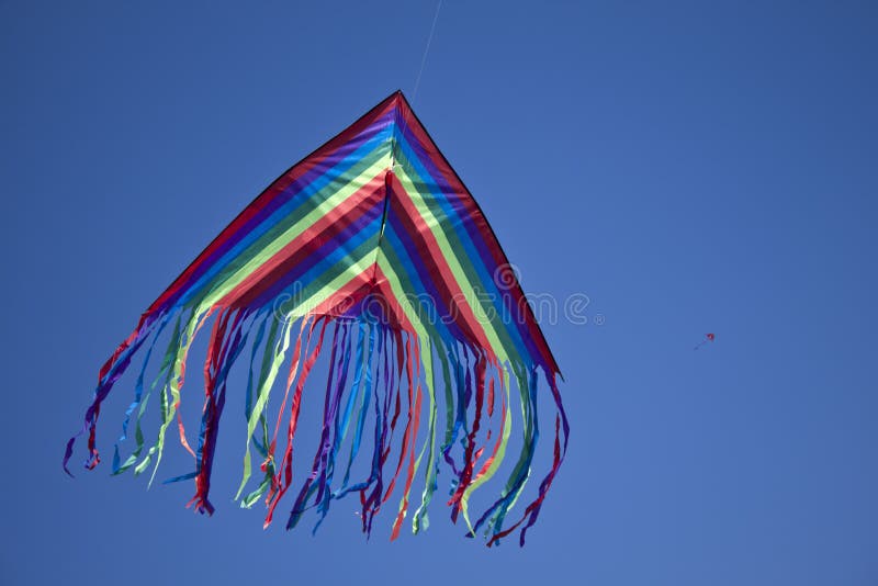 Blue kite in blue sky stock photo. Image of colourful - 21918560