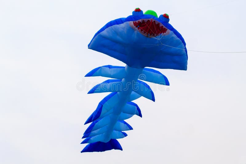 Blue kite that is flying stock image. Image of colorful - 102235973