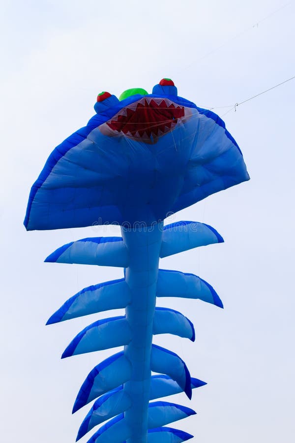 Blue kite that is flying stock photo. Image of wires - 103033720