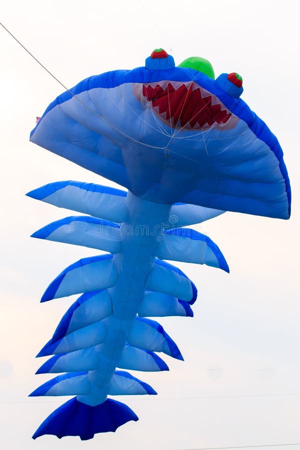 Blue kite that is flying stock image. Image of mouth - 103275979