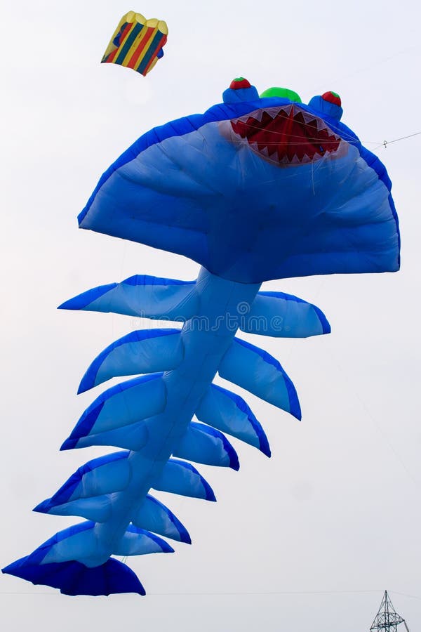 Blue kite that is flying stock image. Image of mouth - 91465067