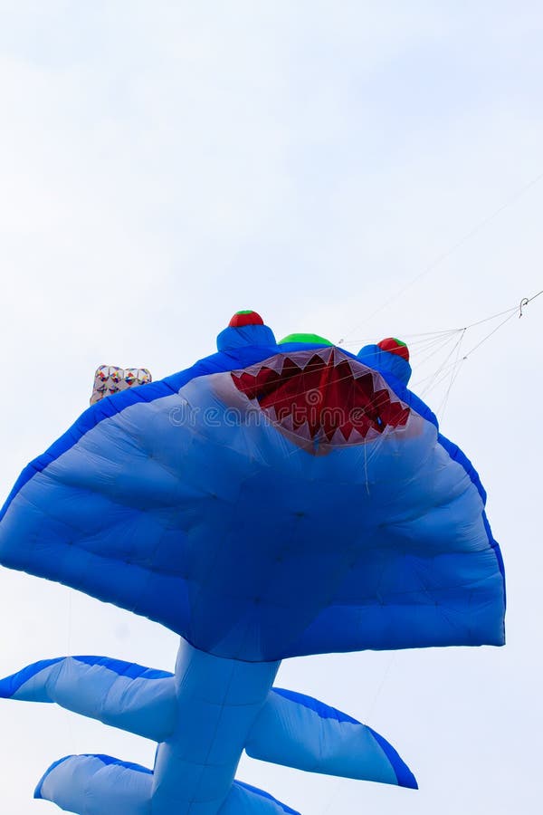 Blue kite that is flying stock image. Image of kite, lisp - 96607335
