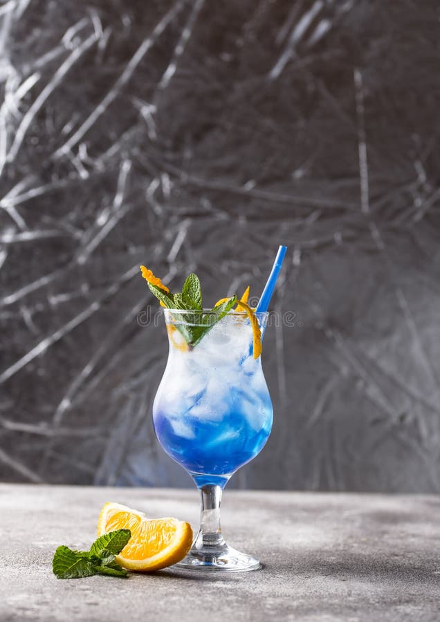 Blue Lagoon Cocktail with Ice and Orange Stock Photo - Image of orange ...