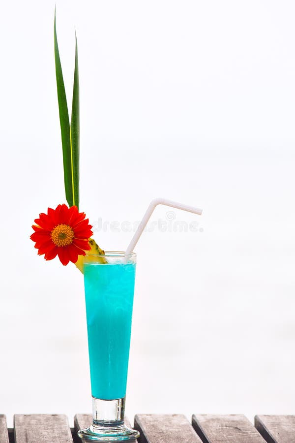 Blue Lagoon Cocktail on the Table at Tropical Beach Stock Image - Image ...