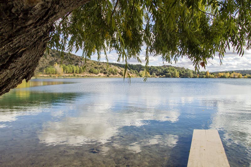 Blue Lagoon with Wooden Pier in Ruidera, Spain Stock Image - Image of ...