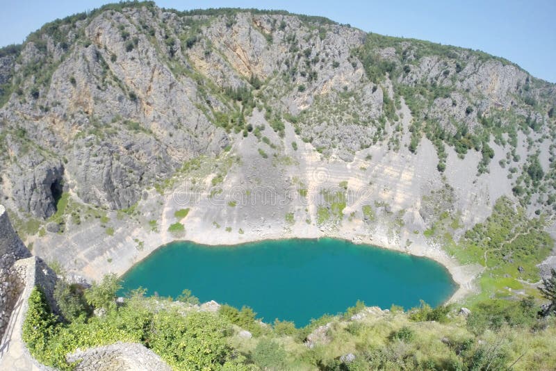 Blue Lake in the Crater of an Extinct Volcano in Croatia.. Stock Image ...