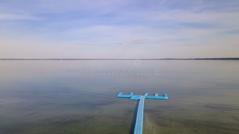 Blue Lake, Blue Sky and Blue Plastic Pier. Small Dock for Boat and Ship ...