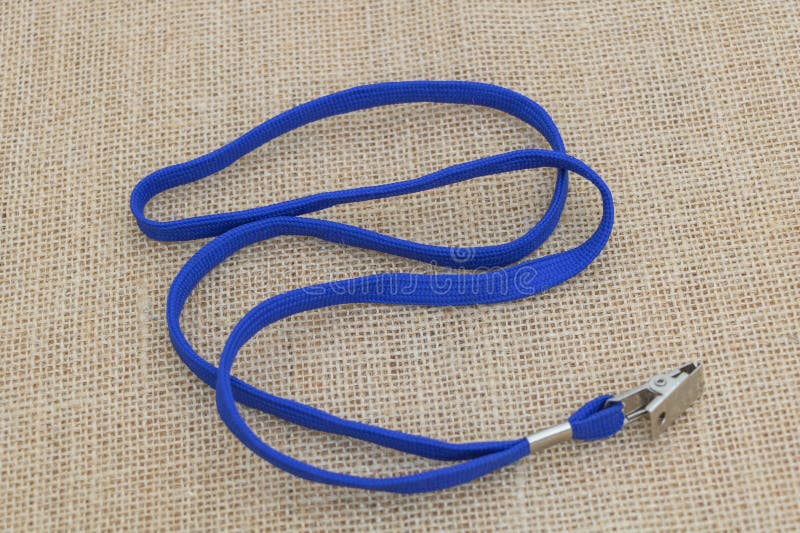 A Blue Lanyard with a Silver Clasp on a Beige Background Stock Image ...