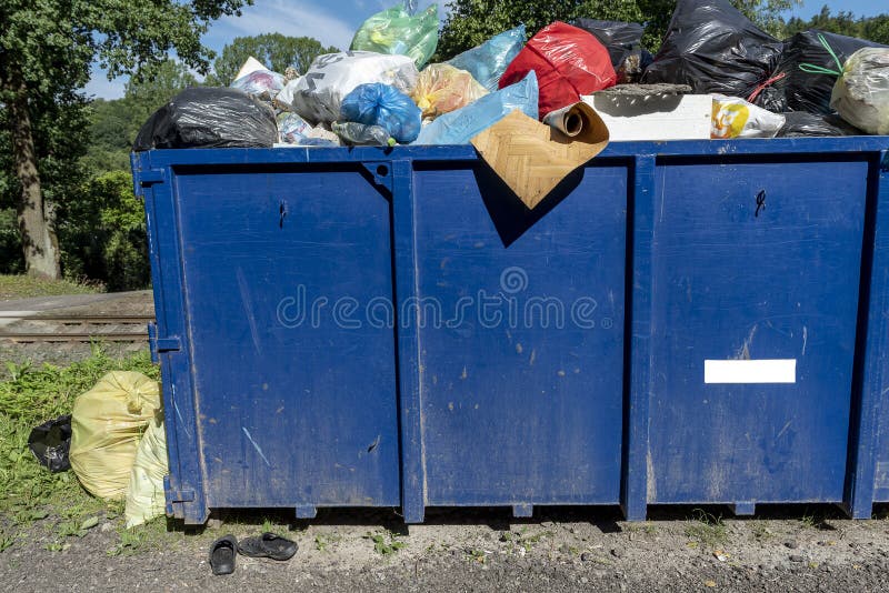 A Blue Large Mixed Waste Container Next To a Rail Stock Image - Image ...
