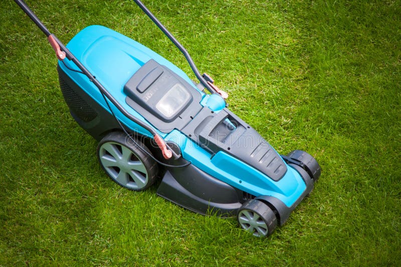 Blue Lawn Mower on Green Grass Cut the Grass Stock Image - Image of ...