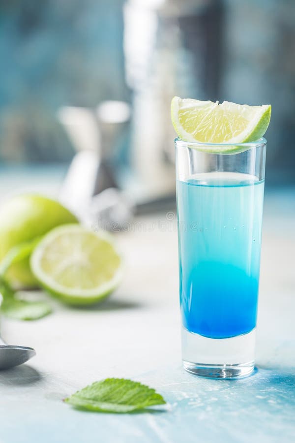 A Blue Layer Alcoholic Cocktail Stock Photo - Image of food, orange ...