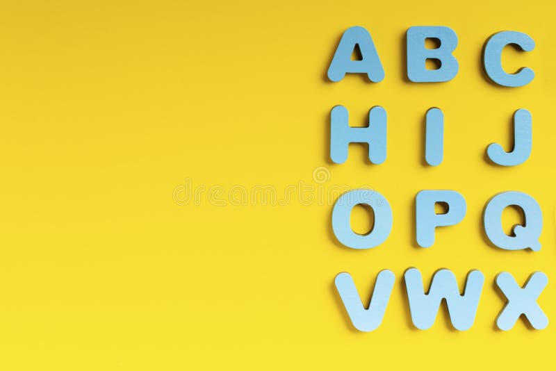 Blue Letters on a Yellow Background Stock Photo - Image of abstract ...
