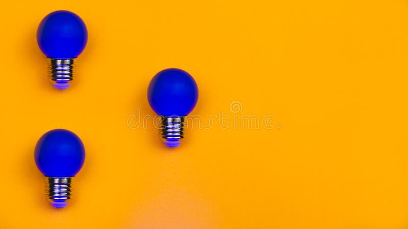 Blue Light Bulbs on a Yellow Background. Several Lightbulbs Stock Image ...