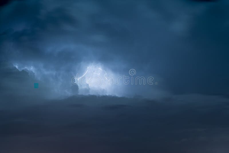 Blue Lightning Strike Surrounded by Storm Clouds Stock Image - Image of ...