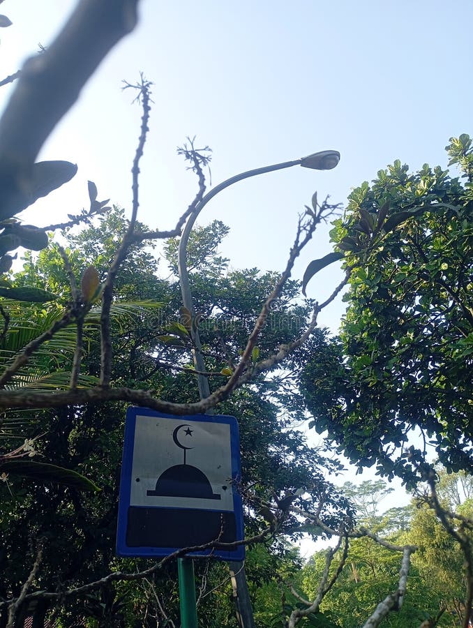 A Blue Location Sign for a Mosque Stock Image - Image of clock, window ...