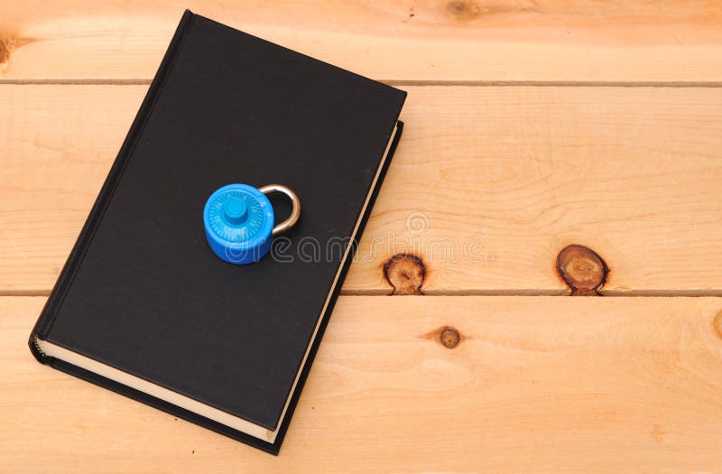 A blue lock and black book stock image. Image of lock - 28687511