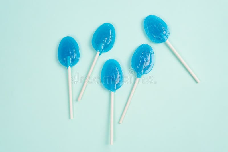 Blue Lollipop Isolated on Blue Background. Stock Image - Image of ...