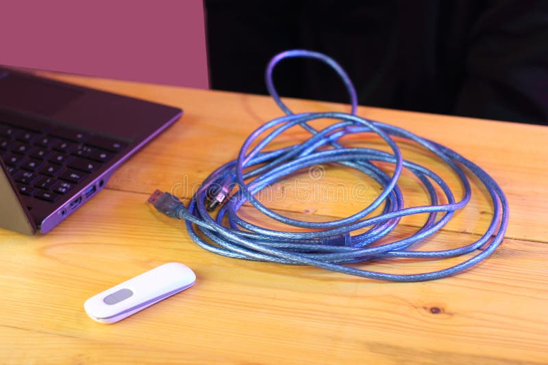 Blue Long Usb Cable on Table Next To Laptop Stock Photo - Image of port ...
