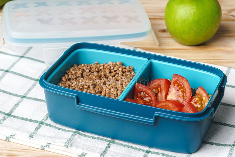 Blue Lunch Box with Buckwheat and Tomatoes Stock Photo - Image of idea ...