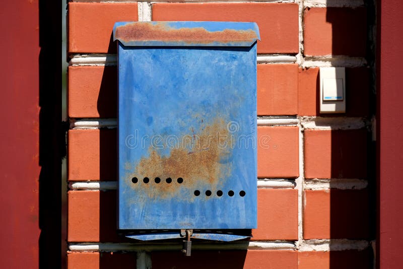 A Blue Mailbox Hangs on a Red Brick Wall Outside. Russian Post Box ...