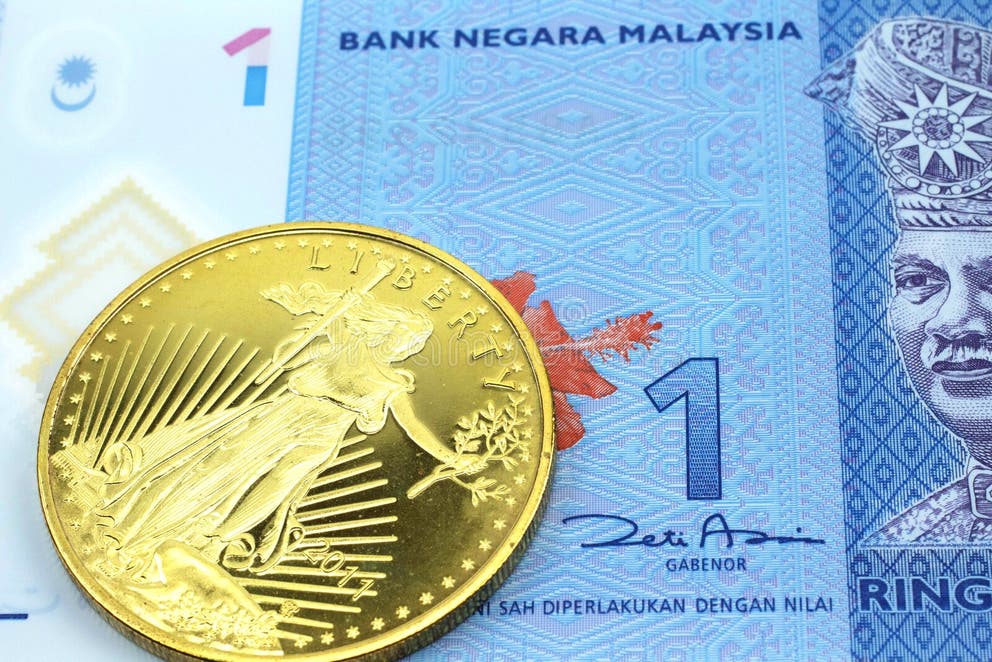 A Blue Malaysian One Ringgit Note with a Gold Coin in Macro Stock Photo ...