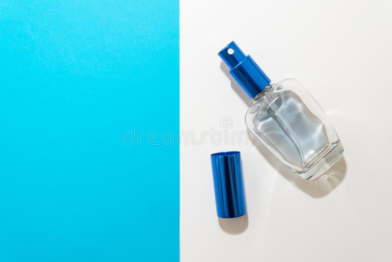 Blue Perfume Bottle on a White and Blue Background. Stock Photo - Image ...