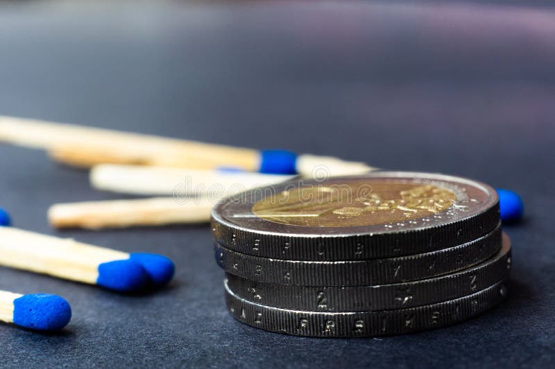 Blue Matches and Stack of Coins on Dark Background Macro Stock Image ...