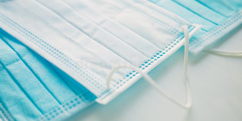 Blue Medical Face Masks on the White Table. Side View Stock Image ...