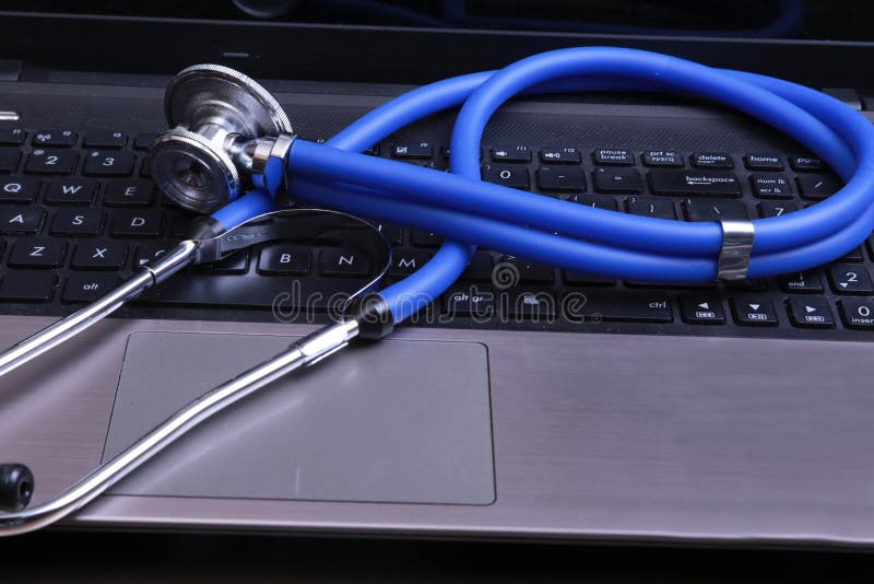 Blue Medical Stethoscope on a Dark Laptop Computer Stock Photo - Image ...