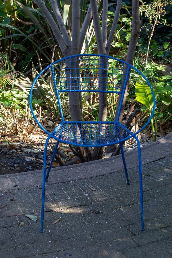 A blue metal garden chair stock image. Image of scenario - 283041911