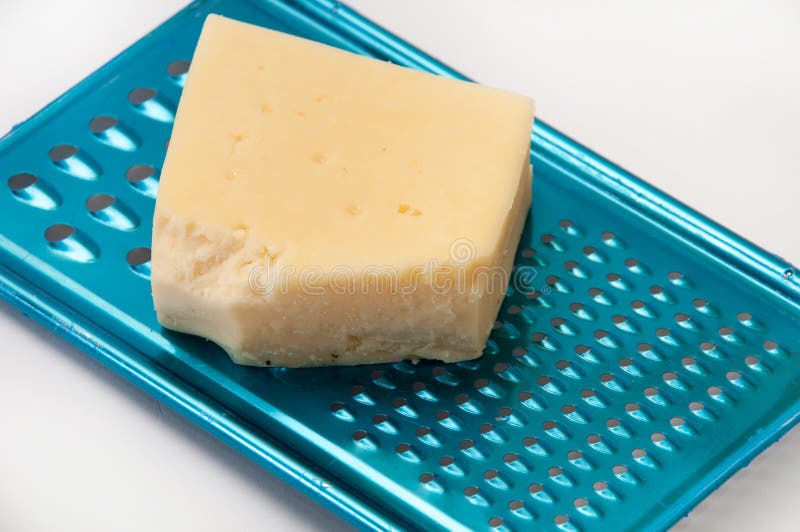 Blue Metal Grater with a Piece of Yellow Cheese Stock Photo - Image of ...