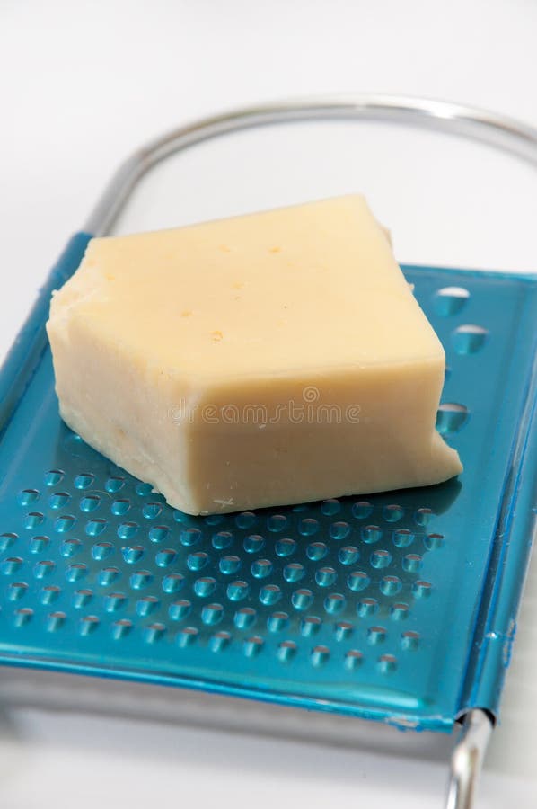 Blue Metal Grater with a Piece of Yellow Cheese Stock Image - Image of ...