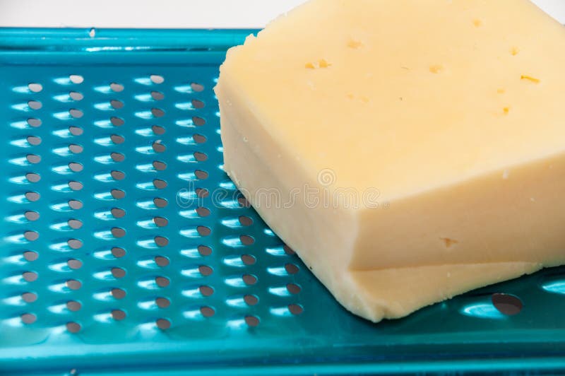 Blue Metal Grater with a Piece of Yellow Cheese Stock Photo - Image of ...