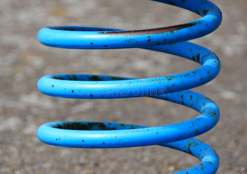 Blue Metal Spring with Rust Stock Image - Image of circular, springy ...