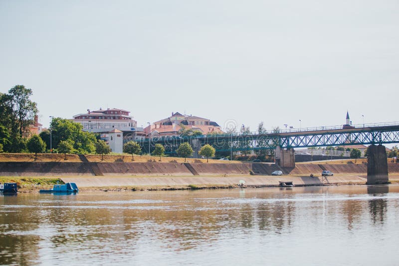 Blue Metallic Bridge Over a Canal with a Background of Buildings Stock ...