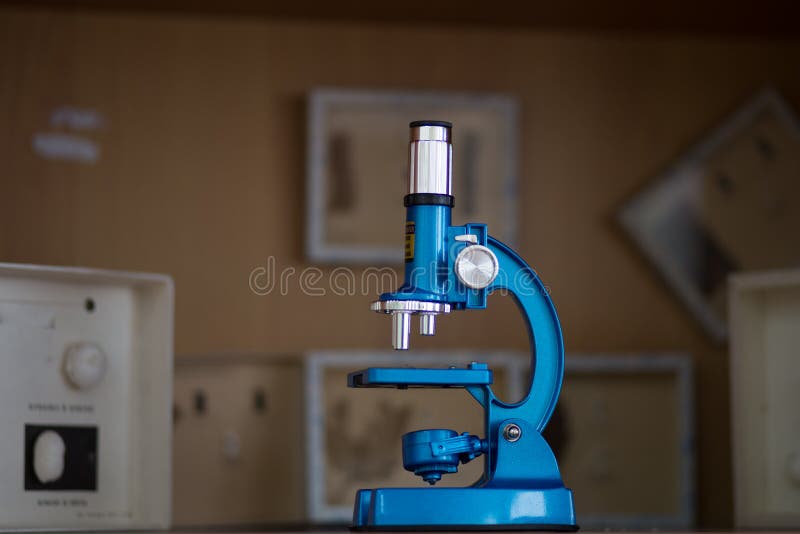 Blue Microscope Stands on a Shelf of a Training Cabinet Stock Photo ...