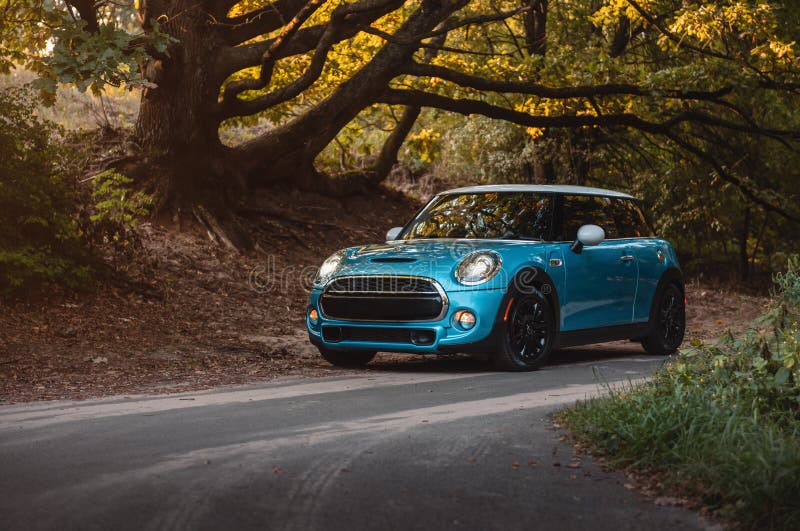 Blue Mini Cooper in Autumn Forest at Sunset. Editorial Photo - Image of ...