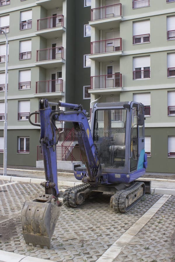 Mini Excavator Digging Up a Electrical Cables from Trench 3 Stock Photo ...
