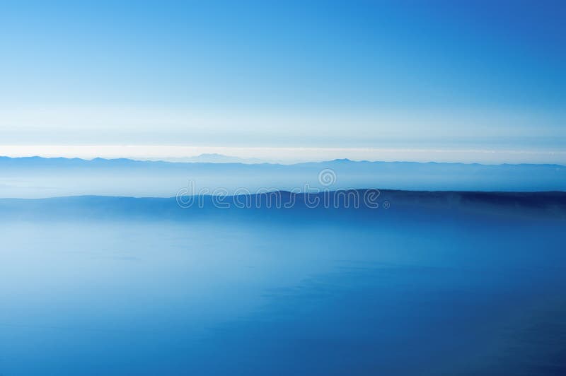 Blue misty horizons - 4151 stock image. Image of dawn - 264492283