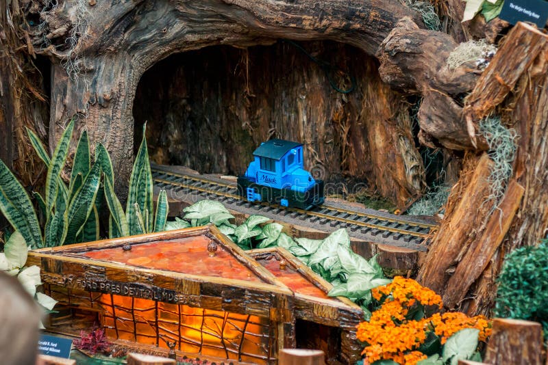 Blue Model Train Running through a City in a Train Display Editorial ...