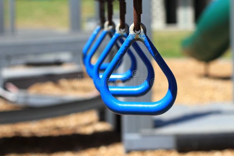 Blue Monkey Bar Rings stock photo. Image of play, playing - 68812782