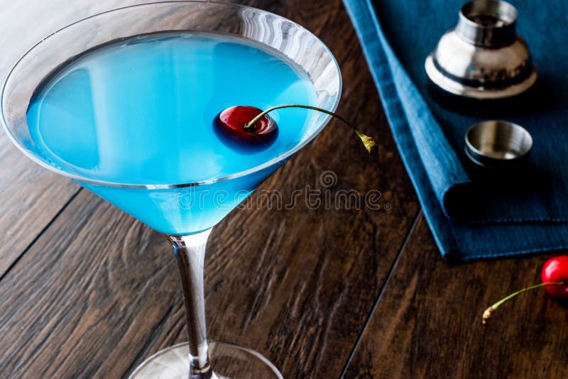 Blue Moon Cocktail with Cherry on Wooden Surface. Stock Photo - Image ...