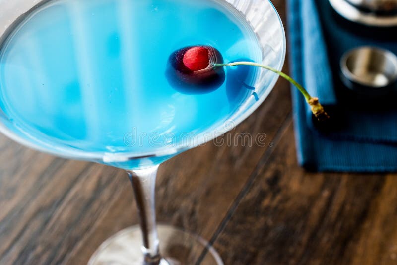 Blue Moon Cocktail with Cherry on Wooden Surface. Stock Photo - Image ...