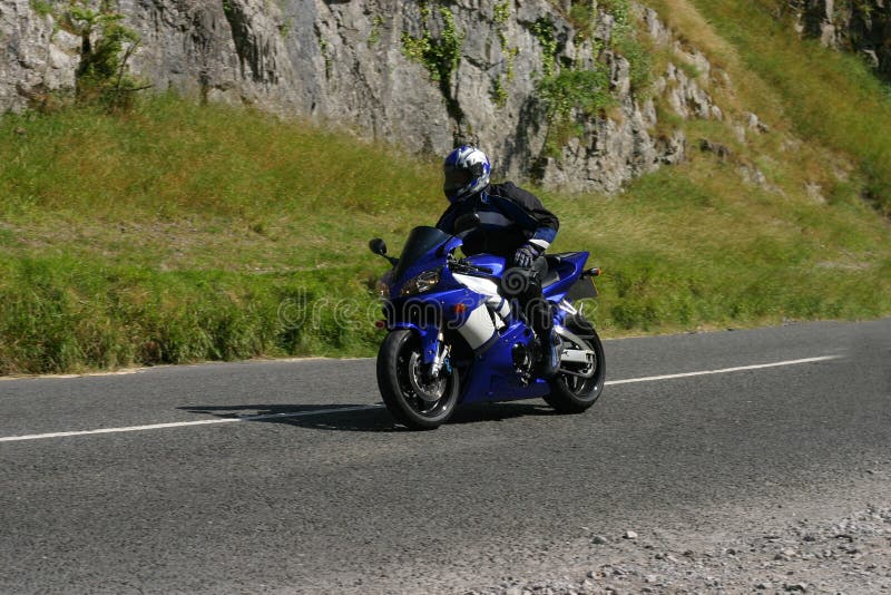 Blue motorbike, one hand stock image. Image of speed, rider - 183029