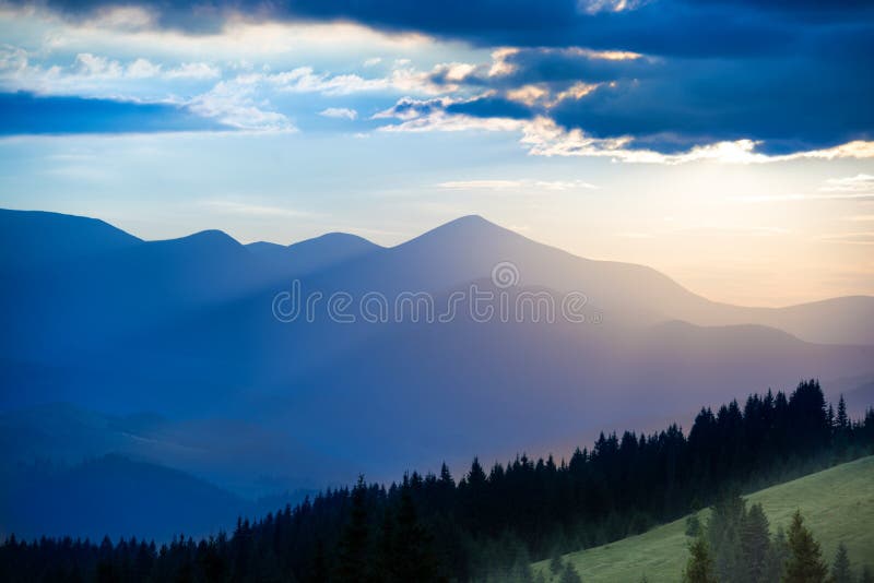 Blue mountains at sunset stock photo. Image of distant - 78195760