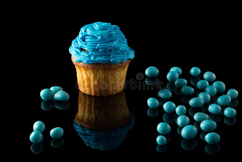 Blue muffin on black stock photo. Image of black, food - 69527958