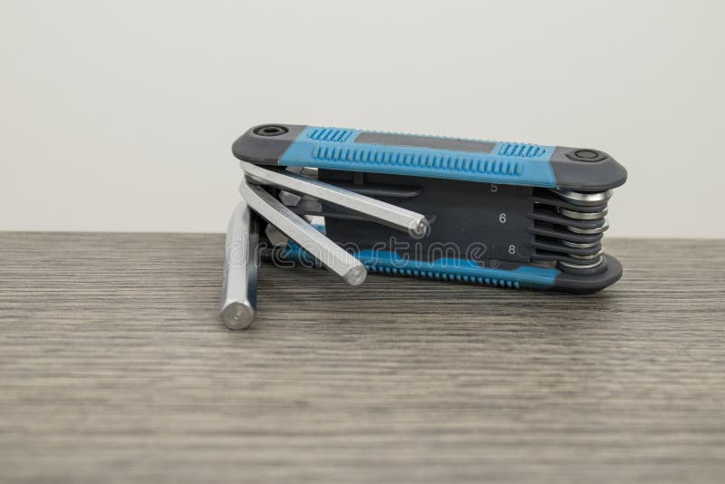 Blue Multitool Allen Keys on a Decorated Wood Table Stock Photo - Image ...